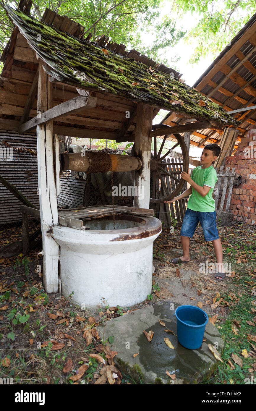 Child pulley bucket well hi-res stock photography and images - Alamy