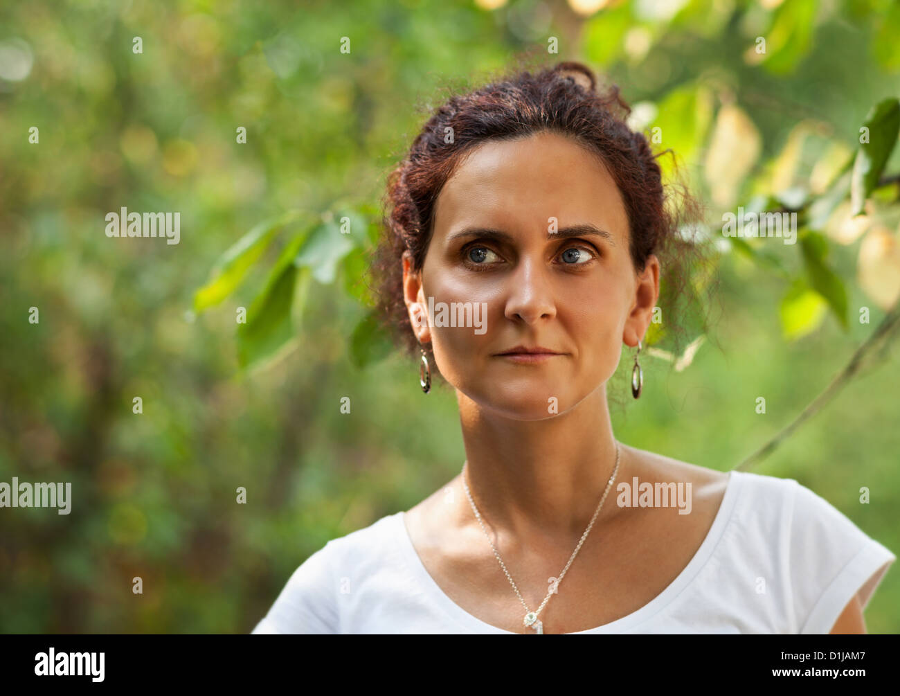 Portrait of a gipsy woman with green eyes, outdoor Stock Photo - Alamy