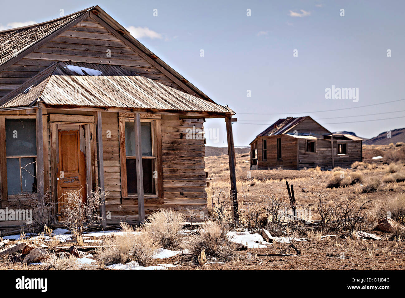 Old rusty cars and abandoned buildings in former gold mining boomtown ...