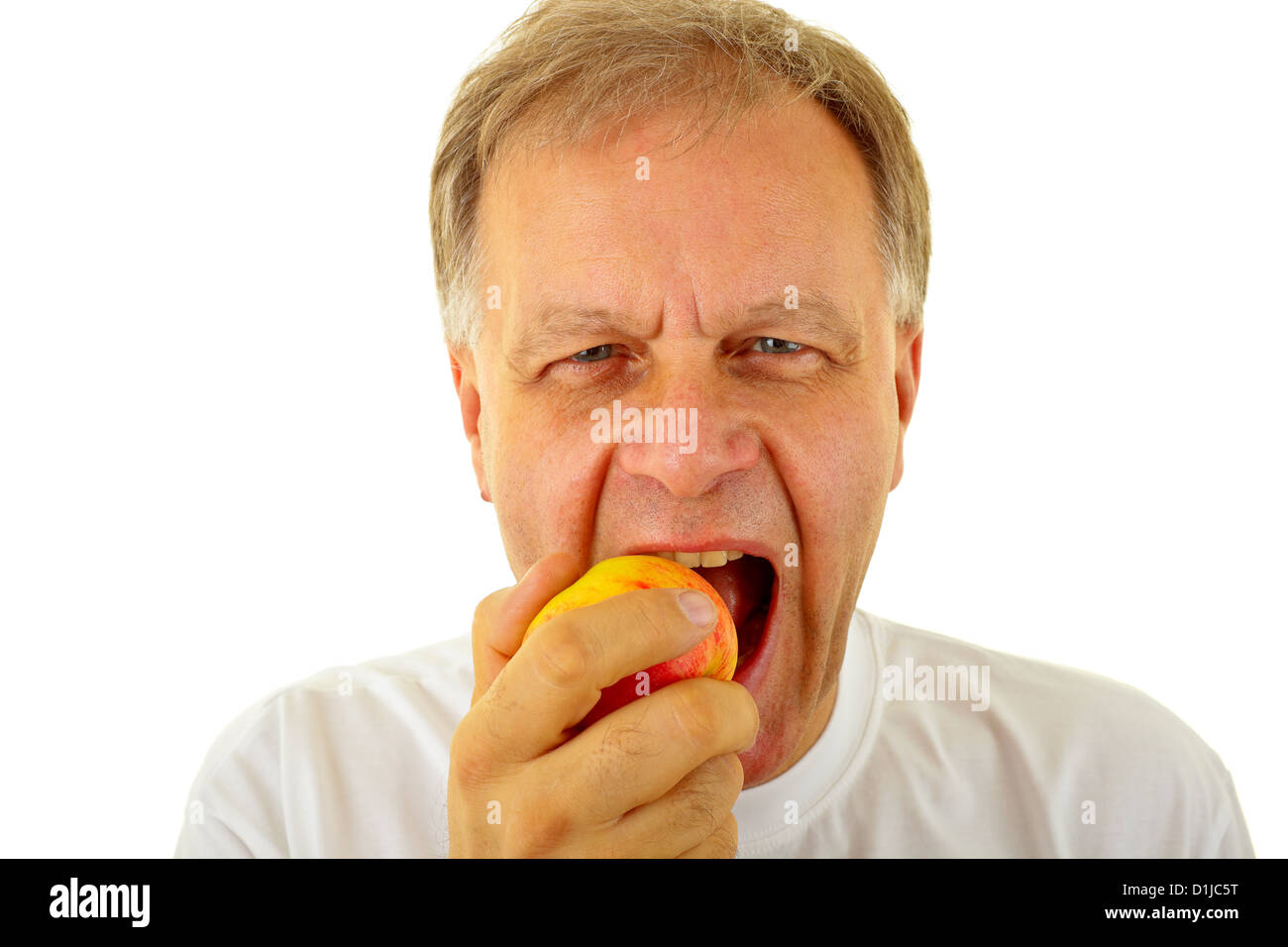 Portrait of mature man eating an apple Stock Photo - Alamy