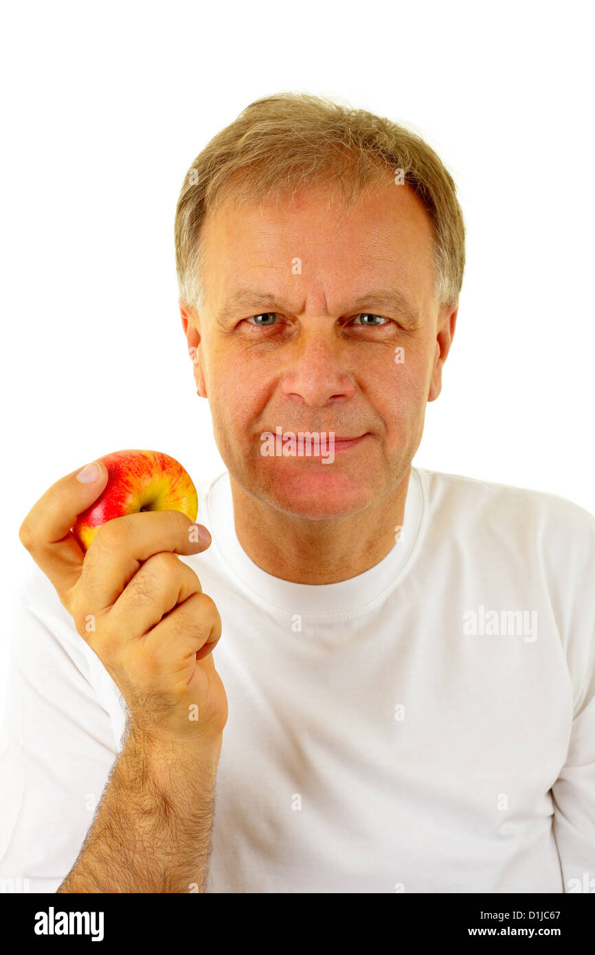 Handsome man holding an apple Stock Photo - Alamy