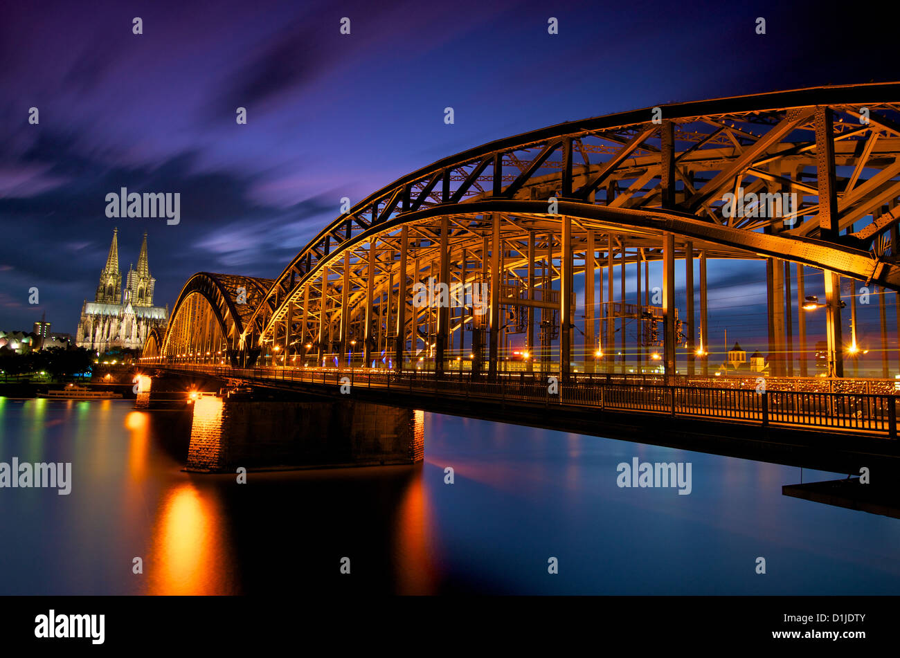 Cologne Cathedral and Railway Bridge just after sunset Stock Photo - Alamy