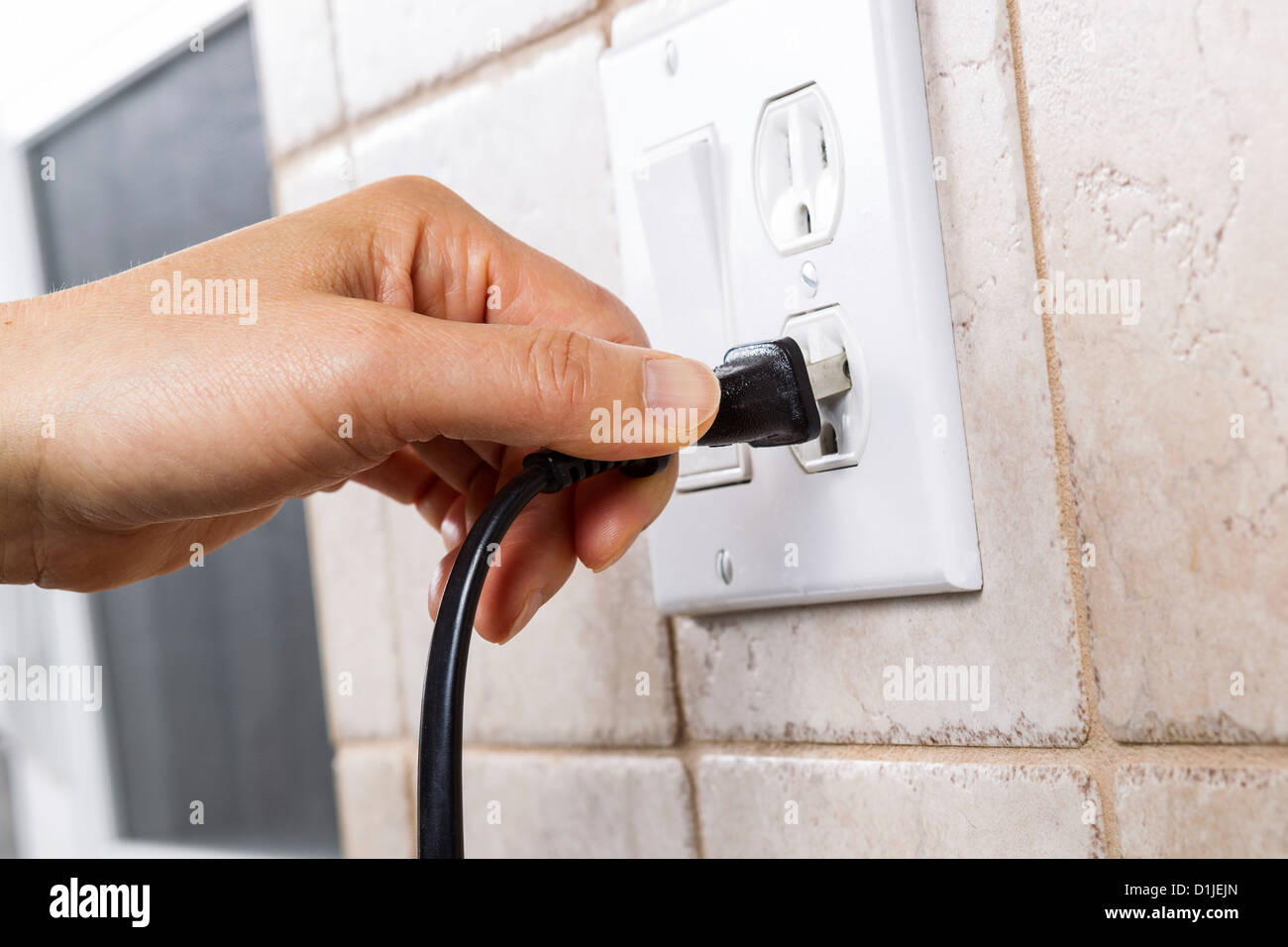Plugging in appliance hi-res stock photography and images - Alamy
