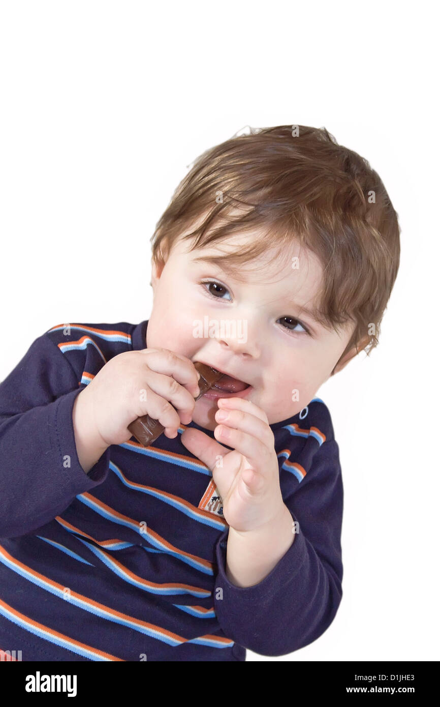 Kid young boy eating chocolate bar hi-res stock photography and images ...