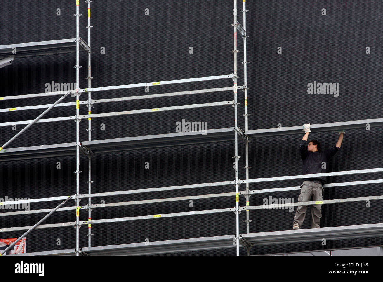 worker at the scaffold Stock Photo - Alamy