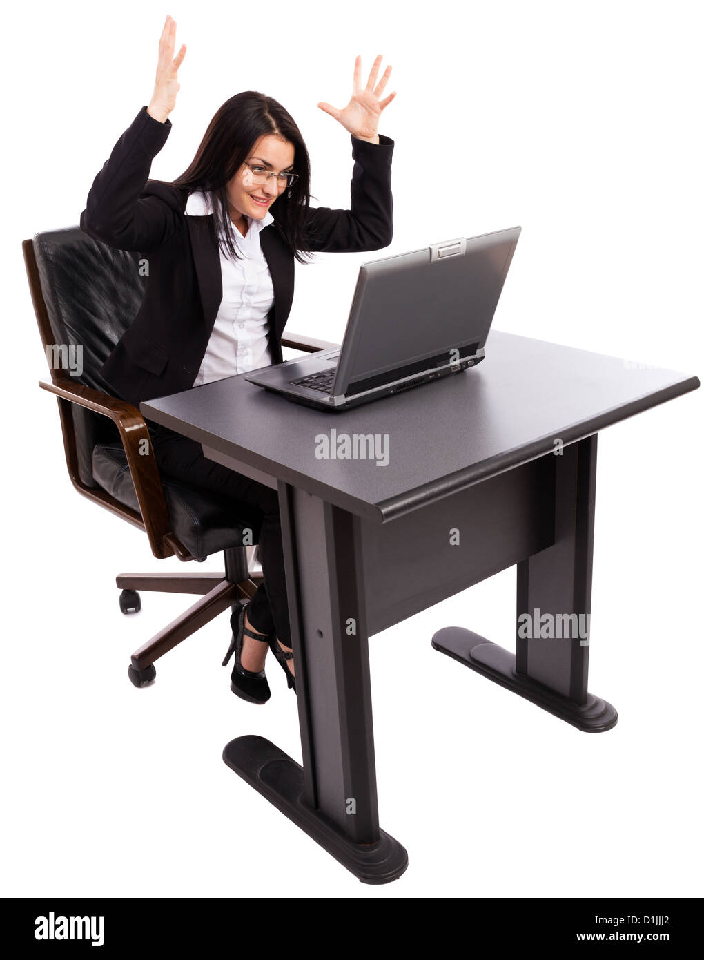 Angry businesswoman sitting at desk while using a laptop isolated on ...