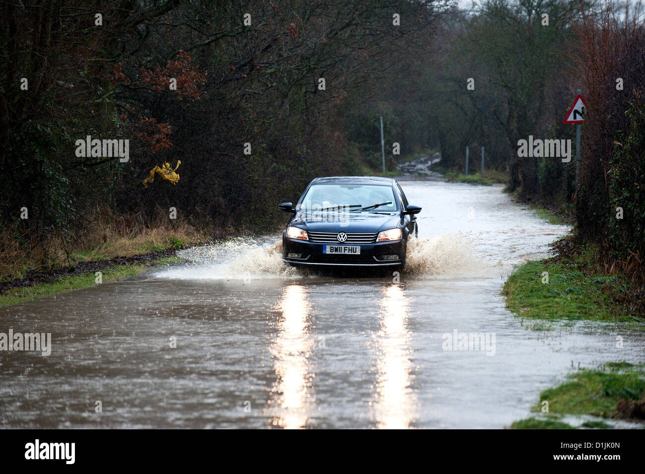 Drivers struggling to drive through flooded roads.Photographer: Gordon ...