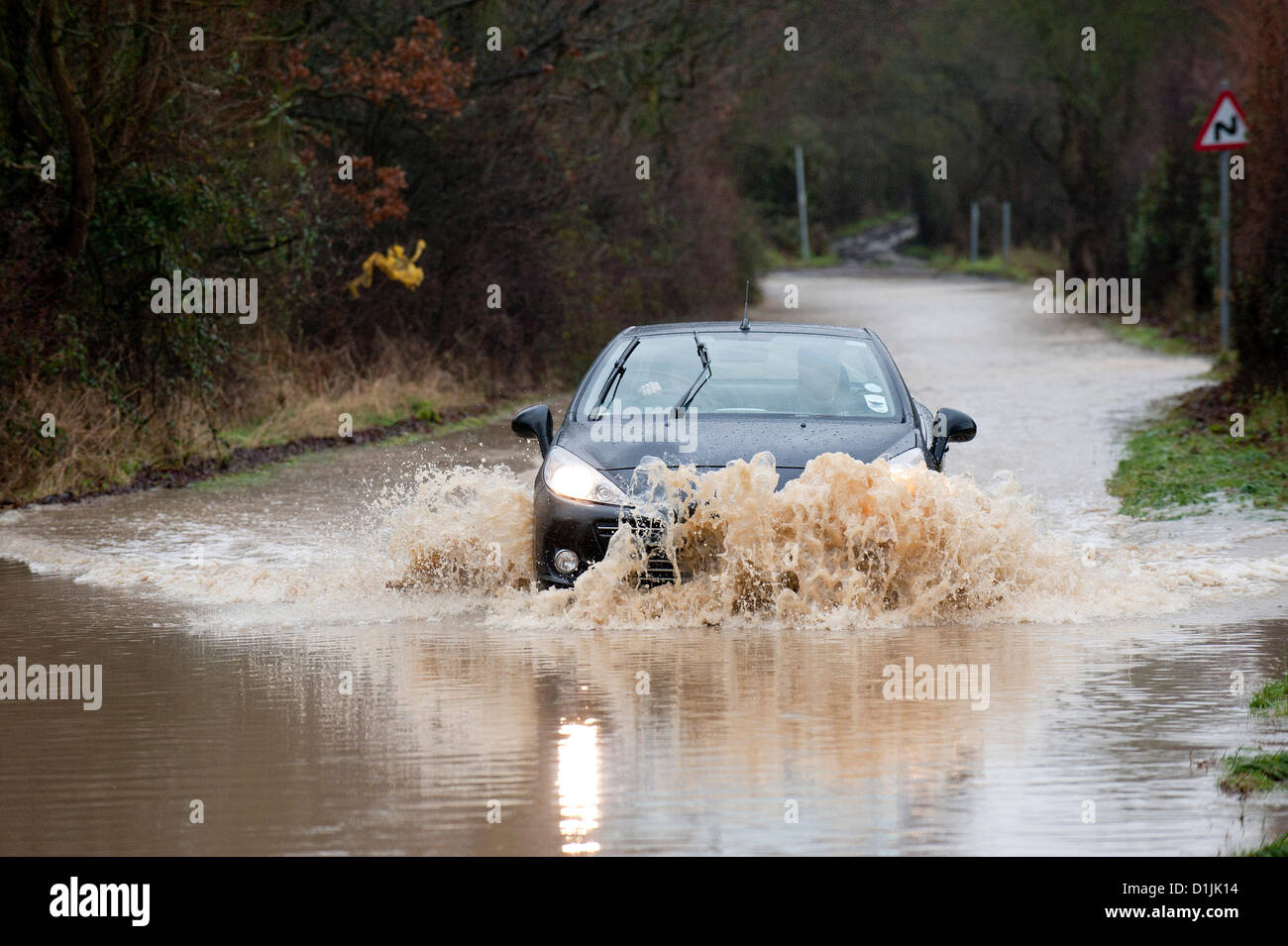 Drivers struggling to drive through flooded roads.Photographer: Gordon ...