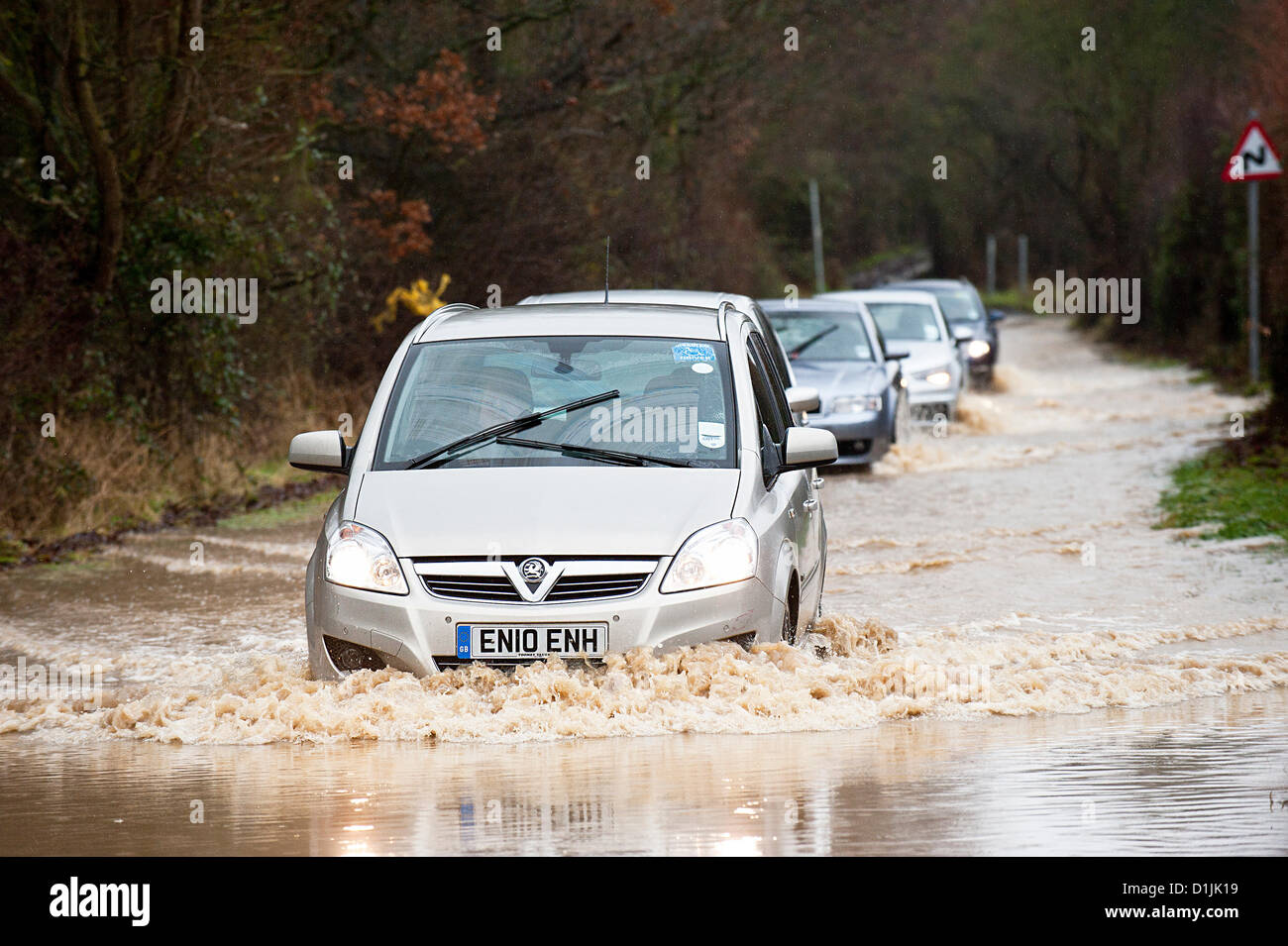 Drivers struggling to drive through flooded roads.Photographer: Gordon ...