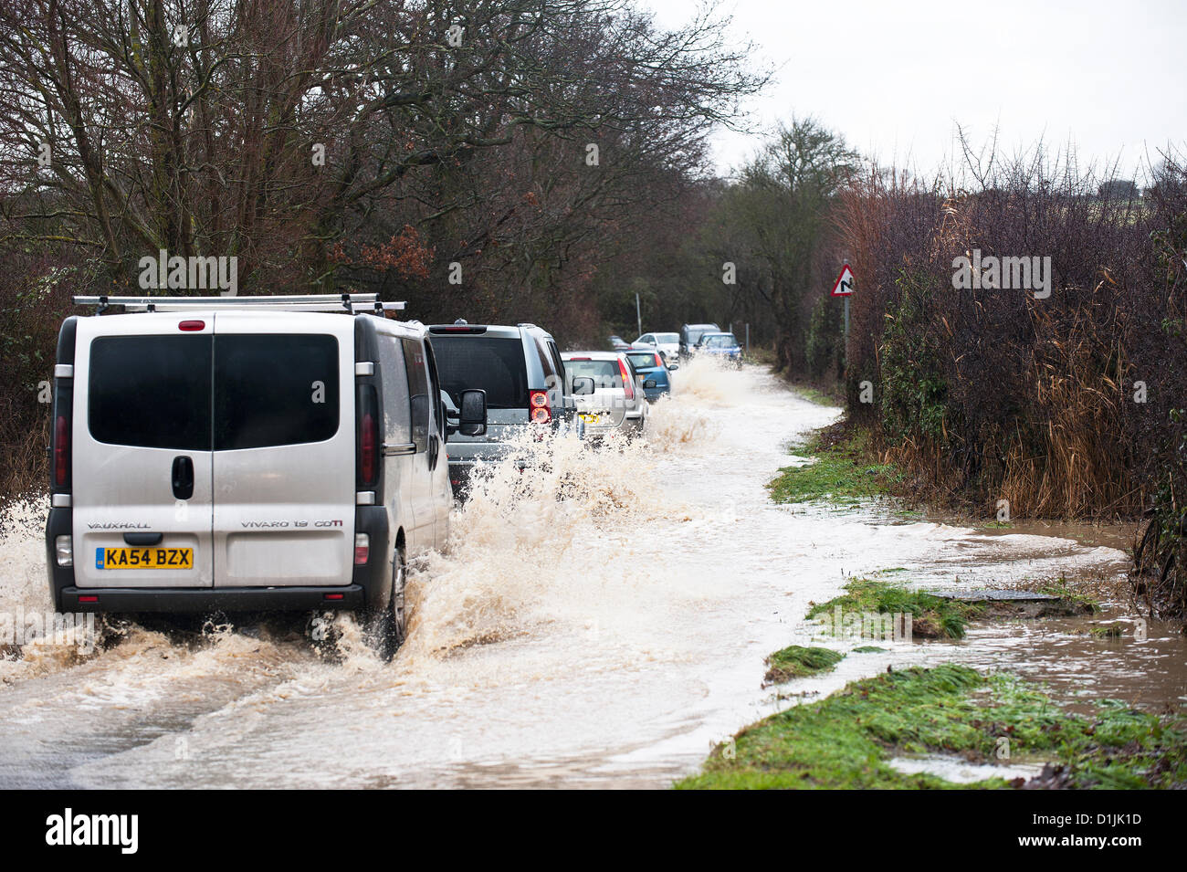 Drivers struggling to drive through flooded roads.Photographer: Gordon ...