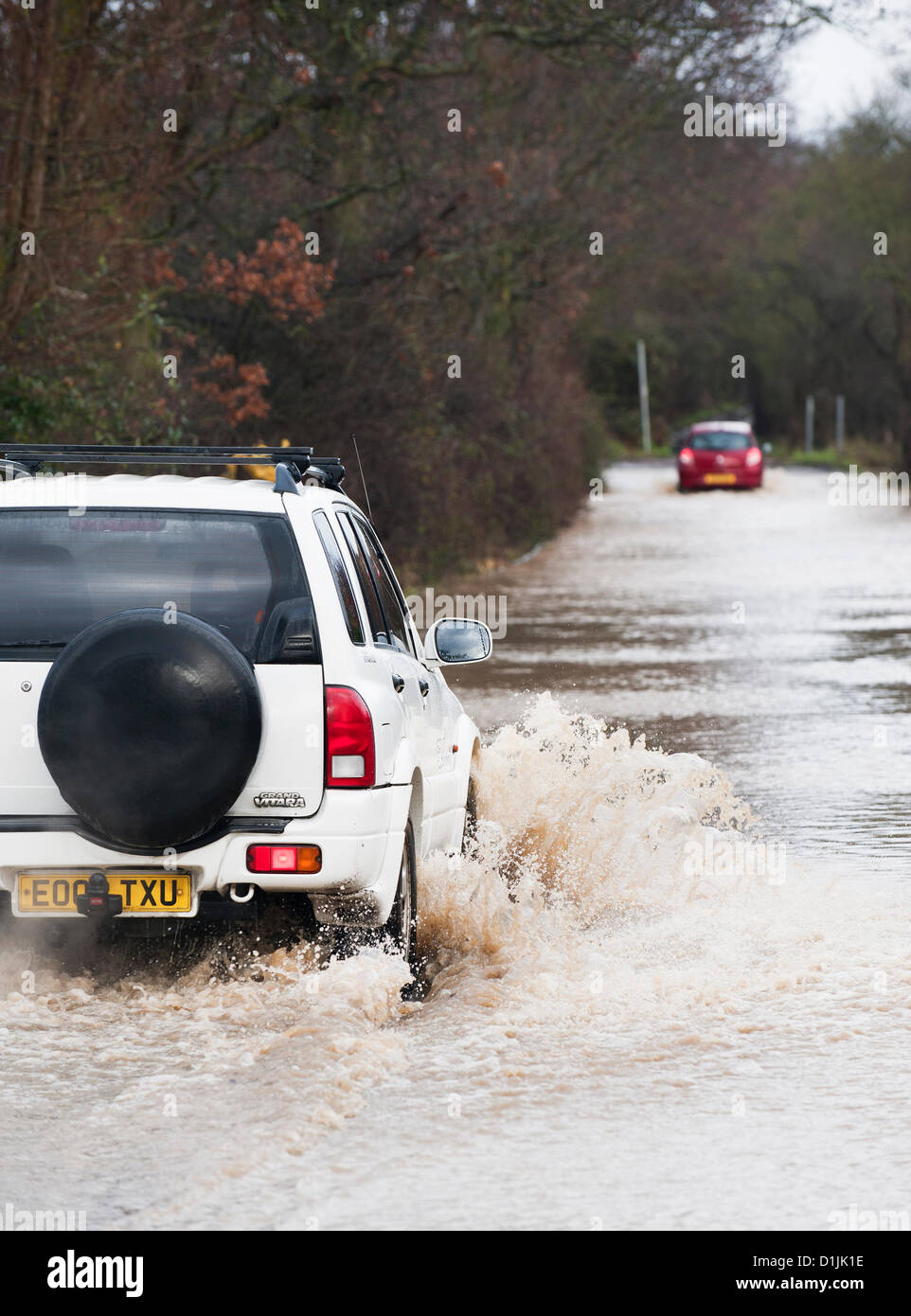 Drivers struggling to drive through flooded roads.Photographer: Gordon ...