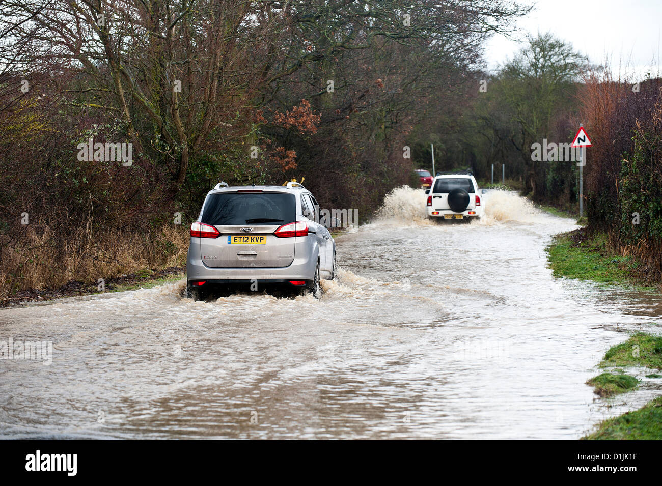 Drivers struggling to drive through flooded roads.Photographer: Gordon ...