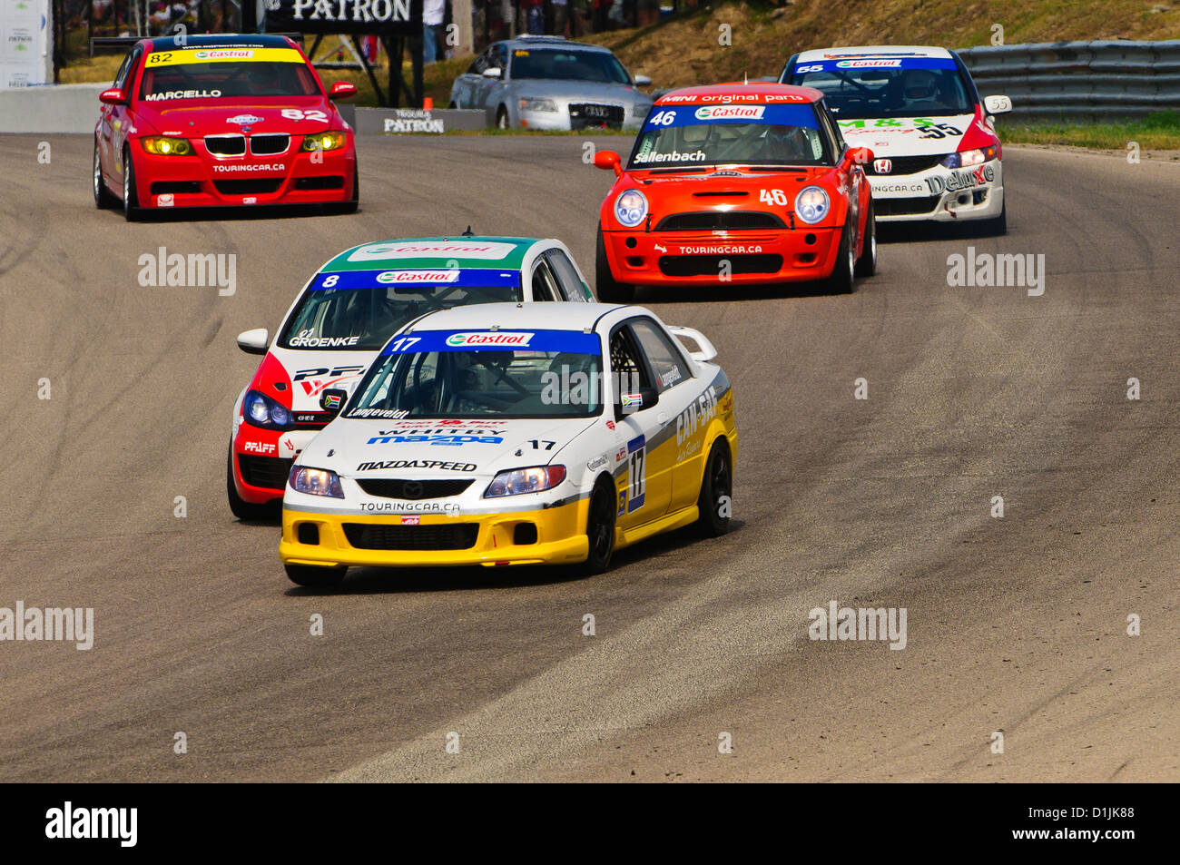 A Mini Cooper defends during the Canadian Touring Car Championship ...