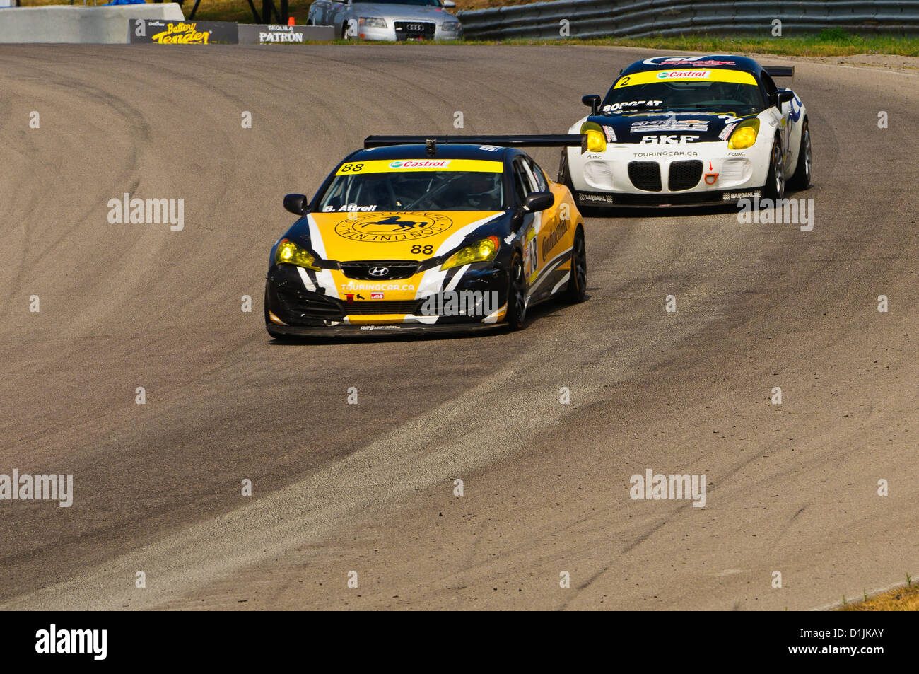 A Hyundai Genesis and Pontiac compete in the CTCC Canadian Touring Car ...