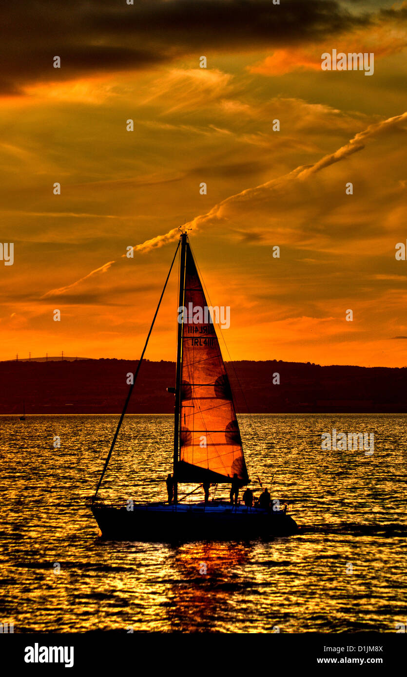 Ship Sailing on Belfast Lough at Sunset Stock Photo - Alamy