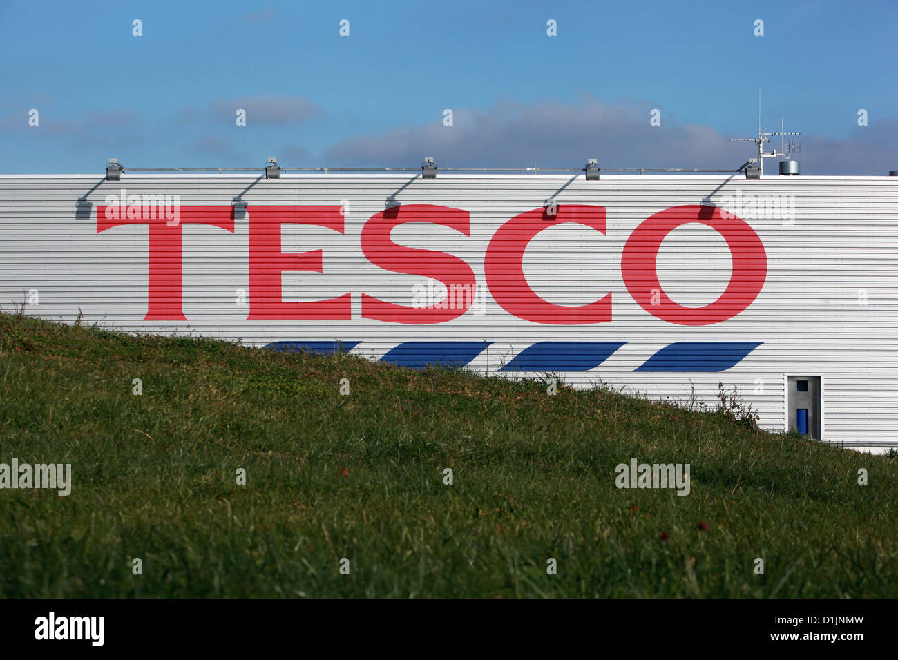 TESCO Store, building behind a grass meadow Stock Photo - Alamy