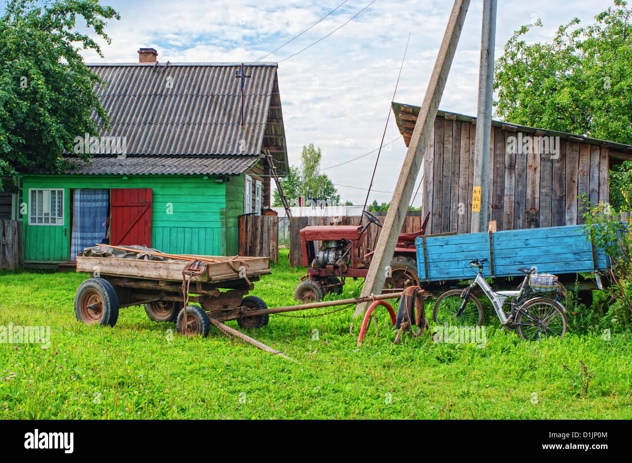Rural transport near village house Stock Photo - Alamy