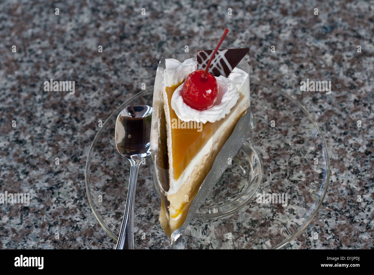 Mango cake with cherry red on the plates Stock Photo - Alamy