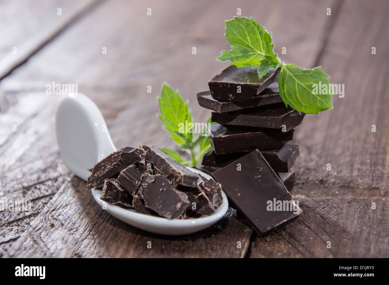 Stacked Chocolate with Mint on wooden background Stock Photo - Alamy