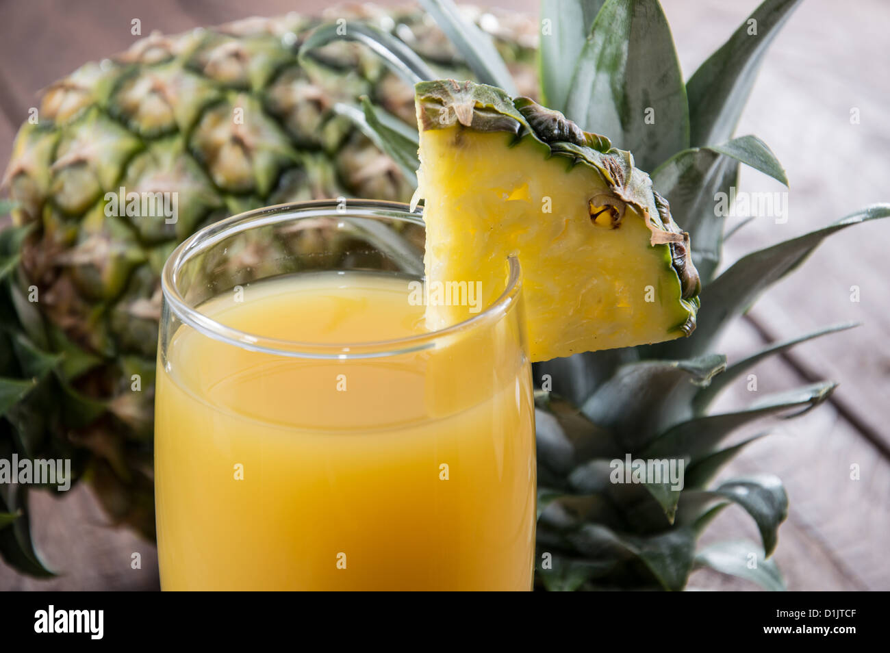 Fresh made Pineapple Juice with fresh pieces of pineapples Stock Photo ...