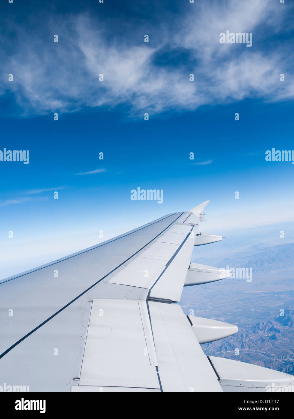 Airplane flying above the clouds Stock Photo - Alamy