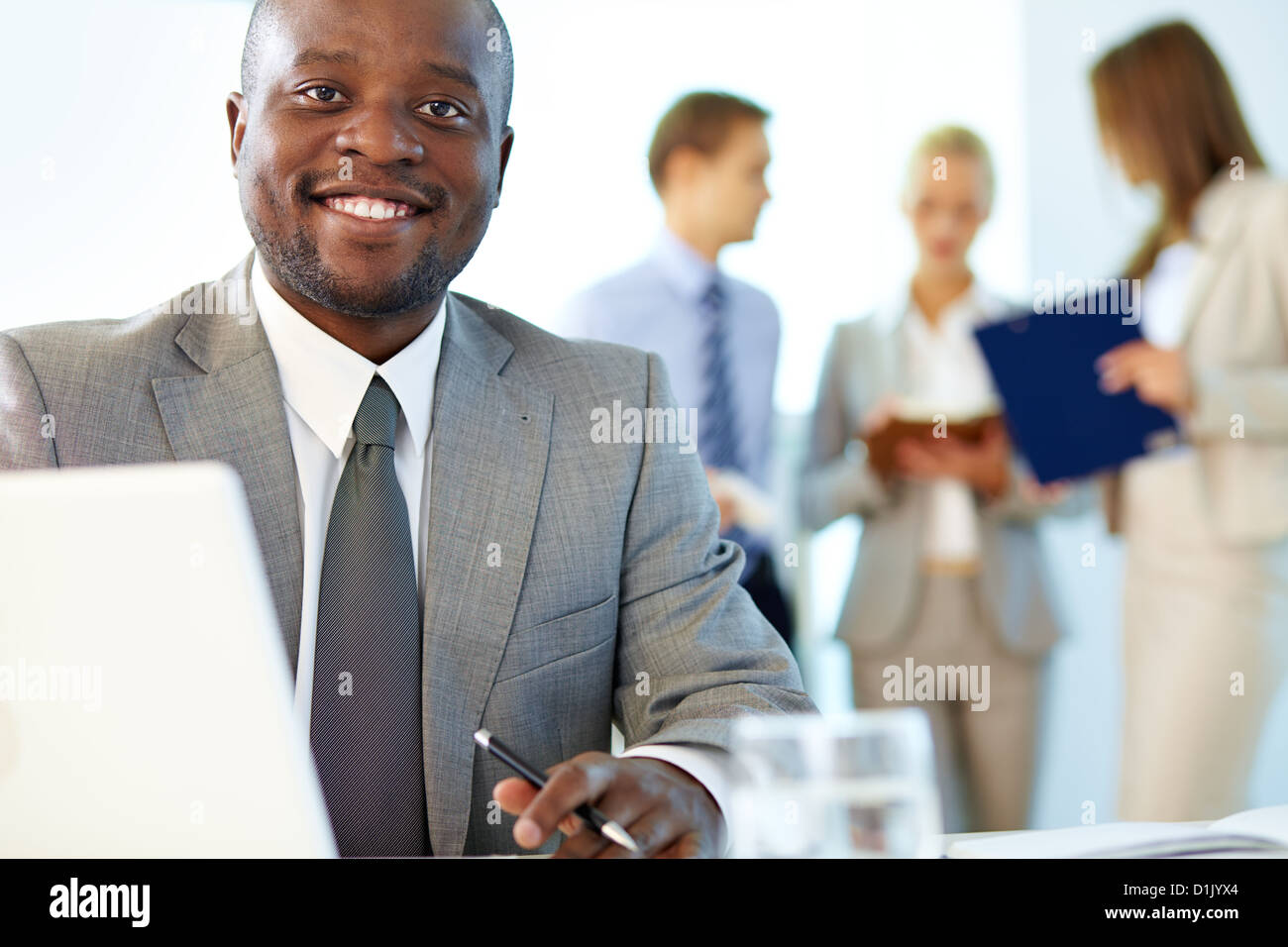 Portrait of happy boss looking at camera in working environment Stock ...