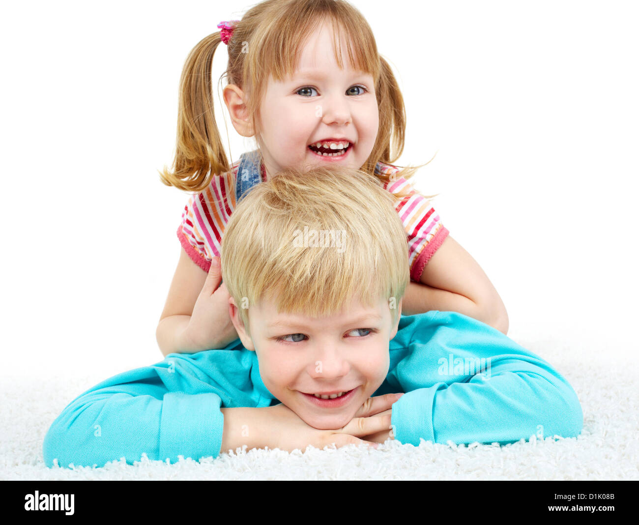 Two happy kids lying on the floor and laughing Stock Photo - Alamy