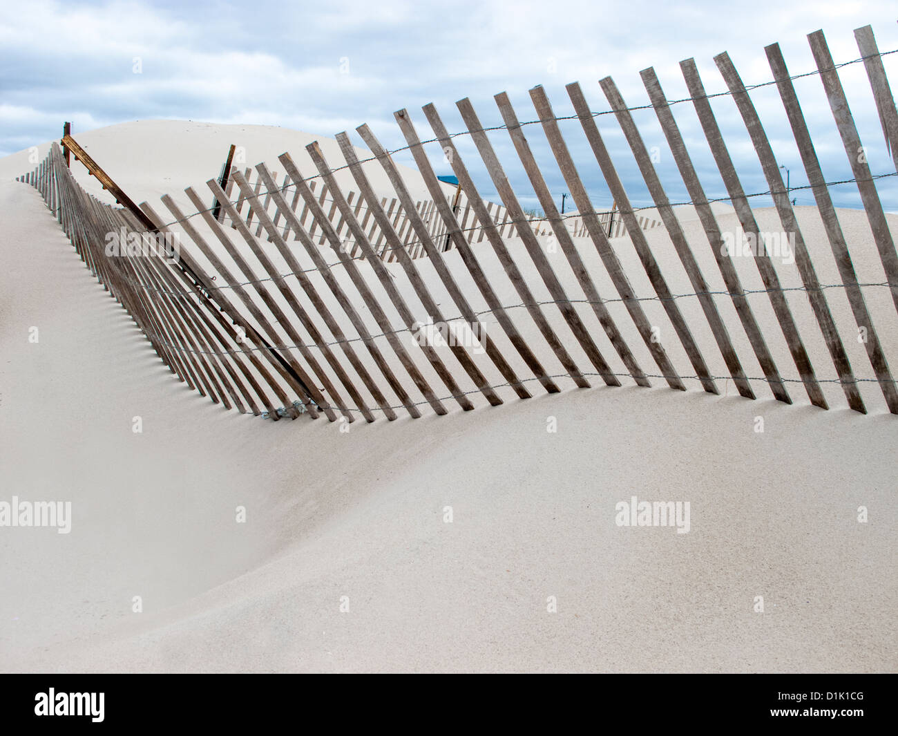 Snow fence on dune Stock Photo - Alamy
