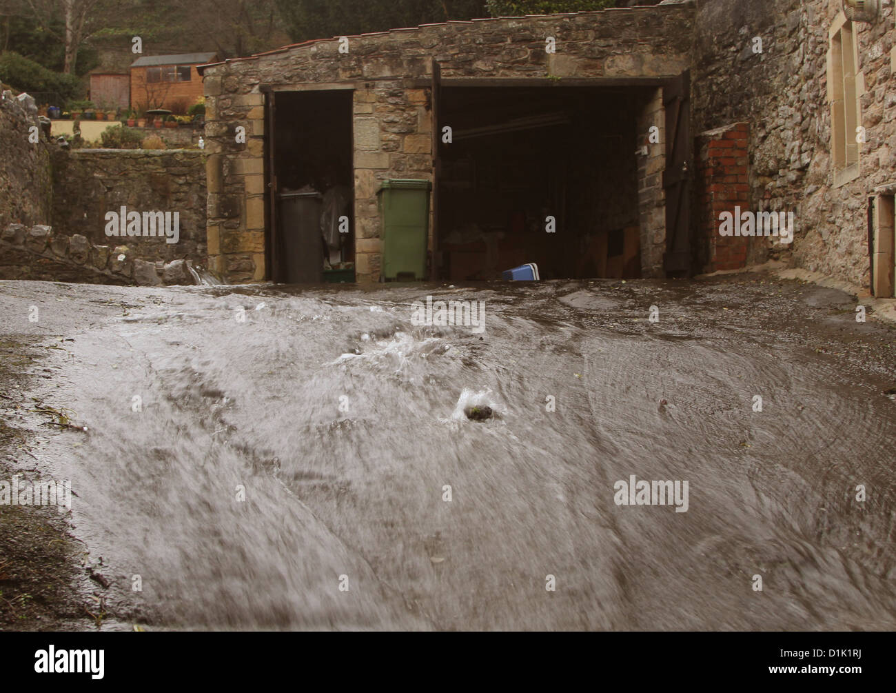 Flood waters flowing off the Mendip hills passing through the Somerset ...