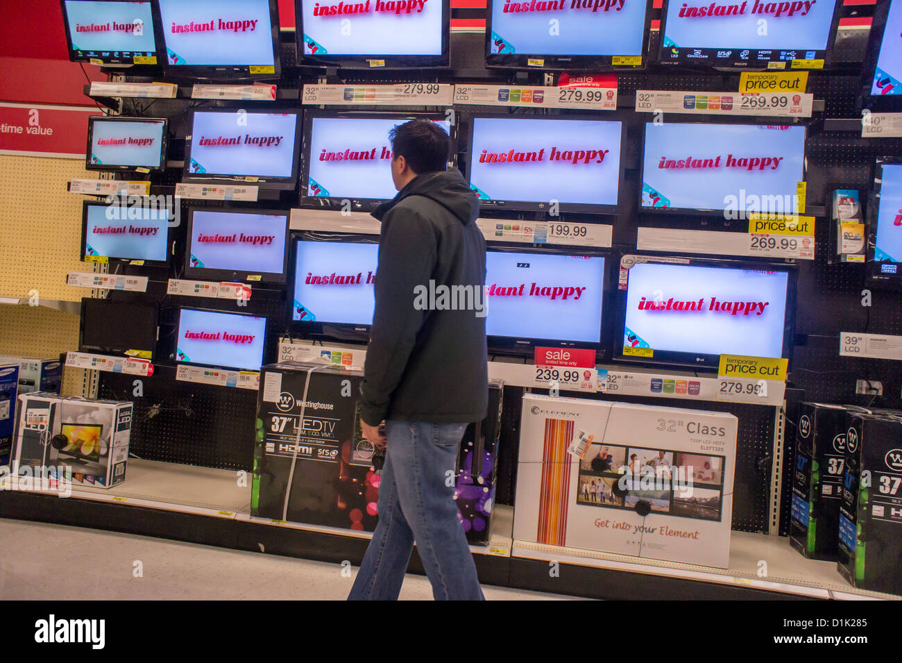 Last minute shoppers browse flat screen televisions in a Target store ...