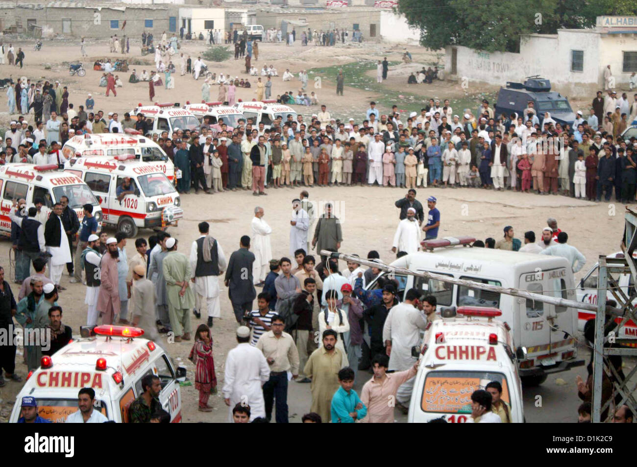 People gather at site after a bomb blast near Jama Masjid Haji Khan ...