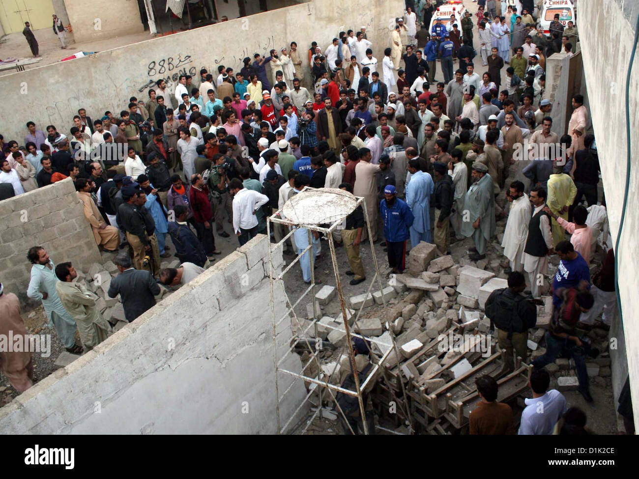 People gather at site after a bomb blast near Jama Masjid Haji Khan ...