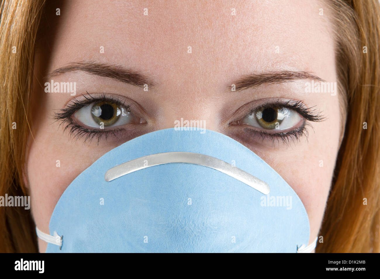 Close up of woman face wearing a filter mask or facemask Stock Photo ...