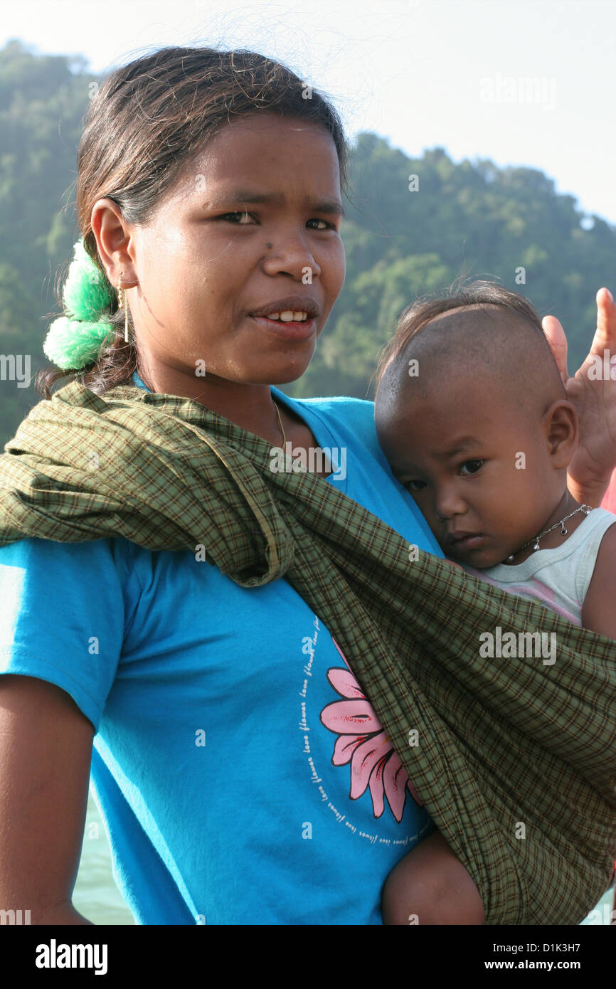 A Moken mother with her child, sea gypsies of the Andaman sea in Koh ...