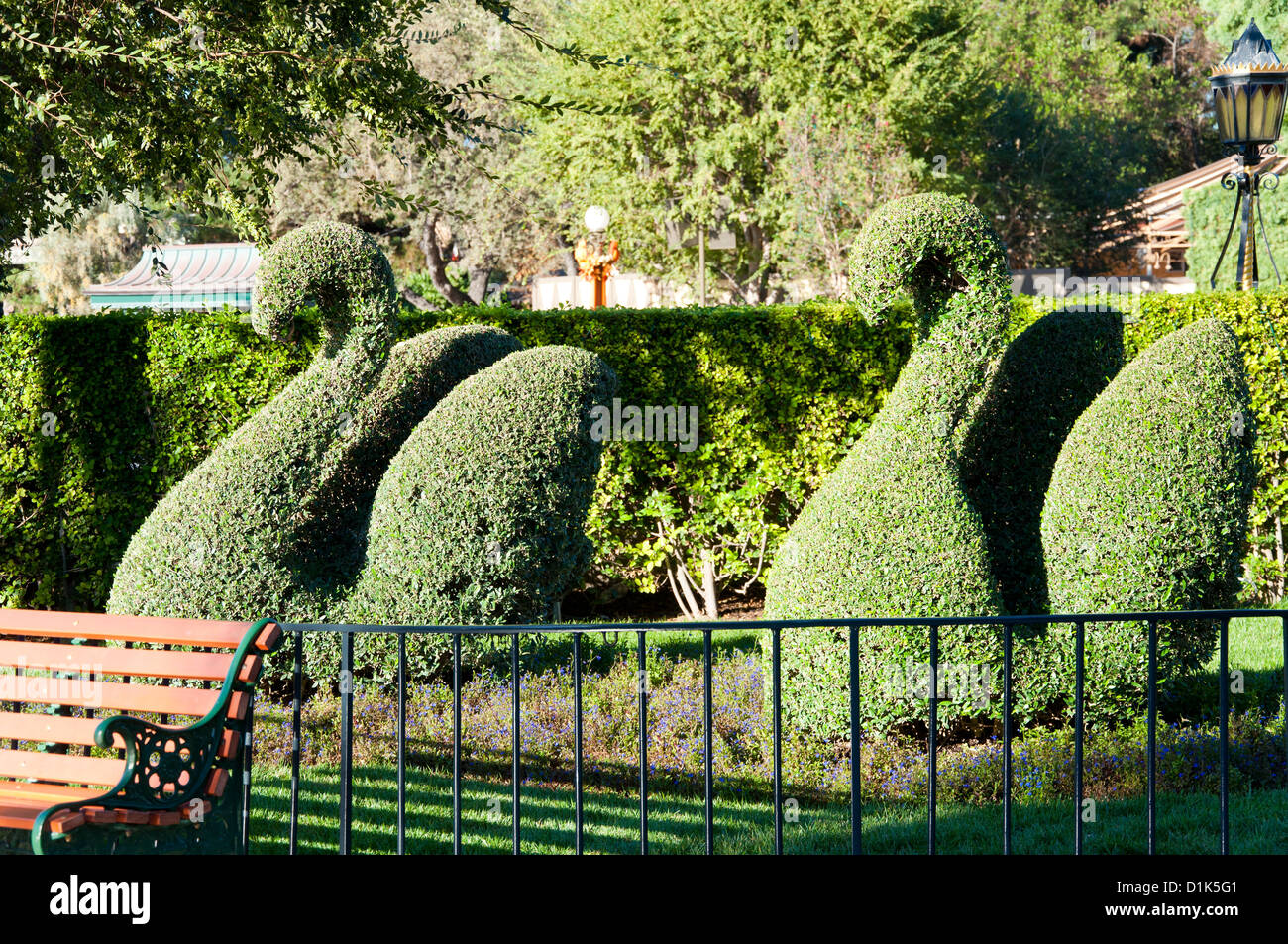 Bush in the shape of animal Stock Photo - Alamy