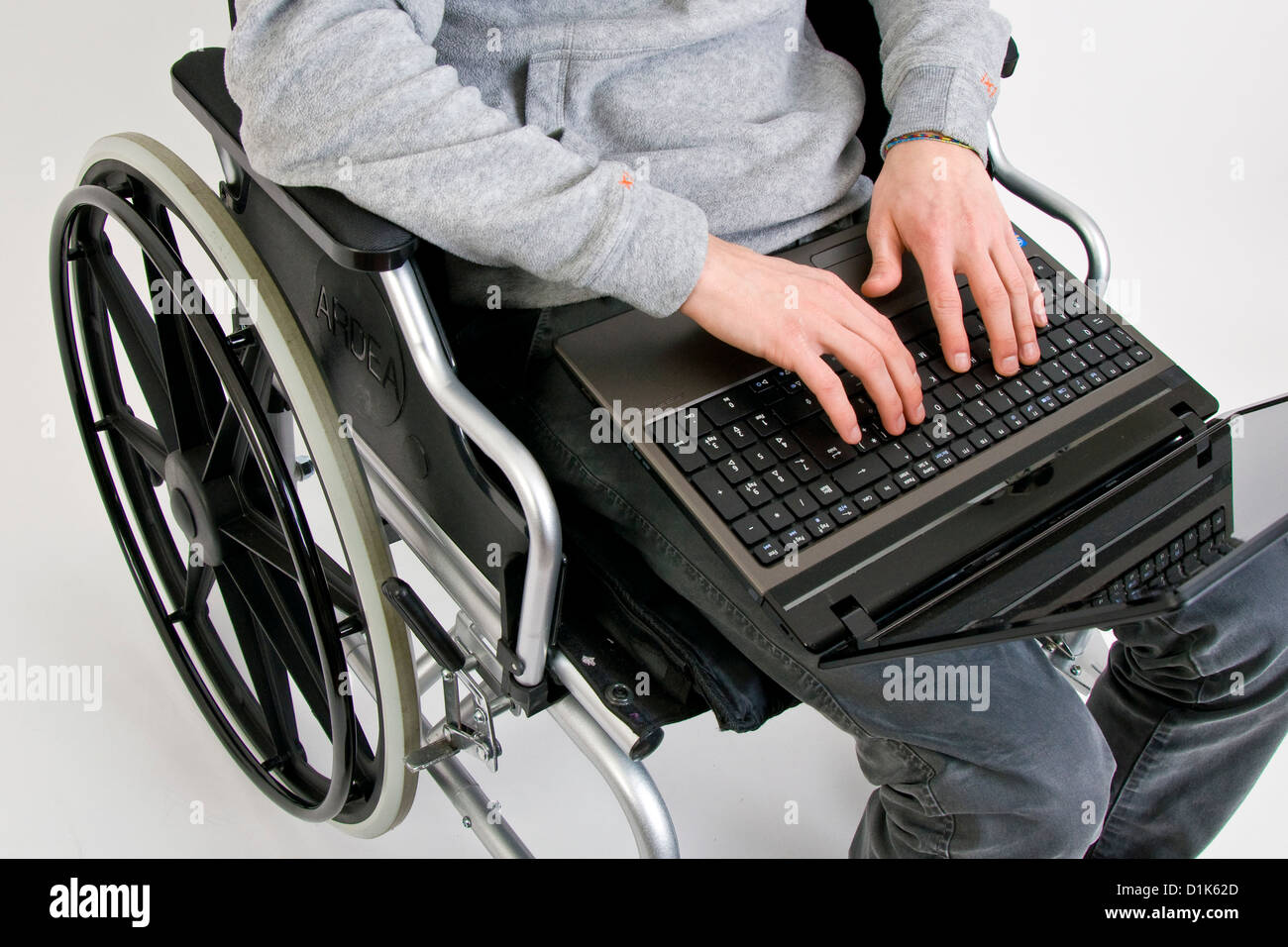 Disabled with computer Stock Photo - Alamy