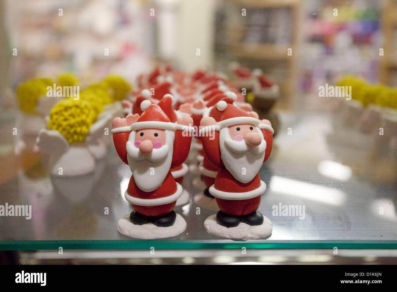 santas made from icing in shop window Stock Photo - Alamy