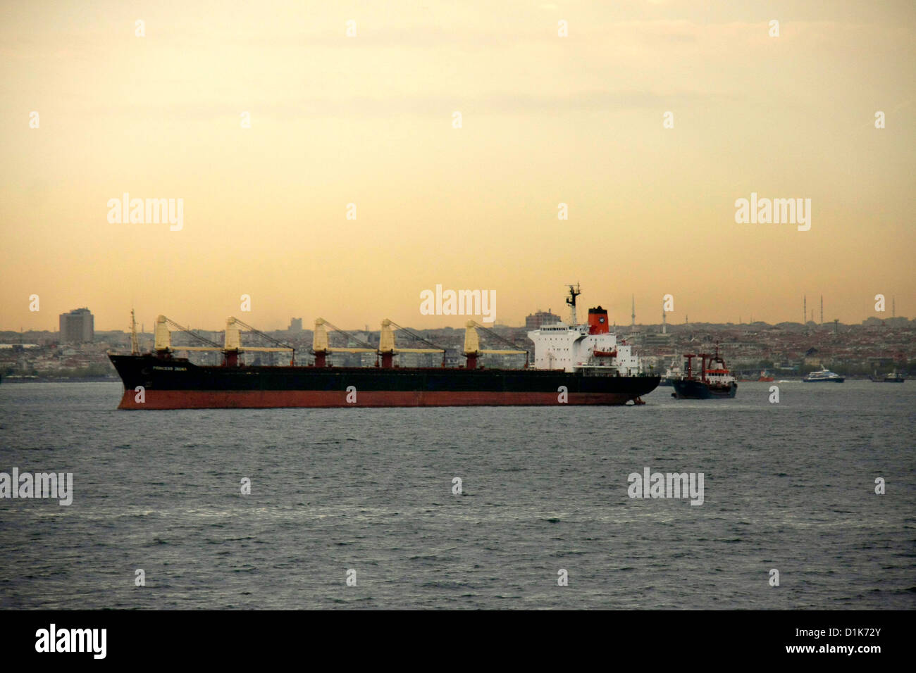 sailing cargo ship in waters Stock Photo - Alamy