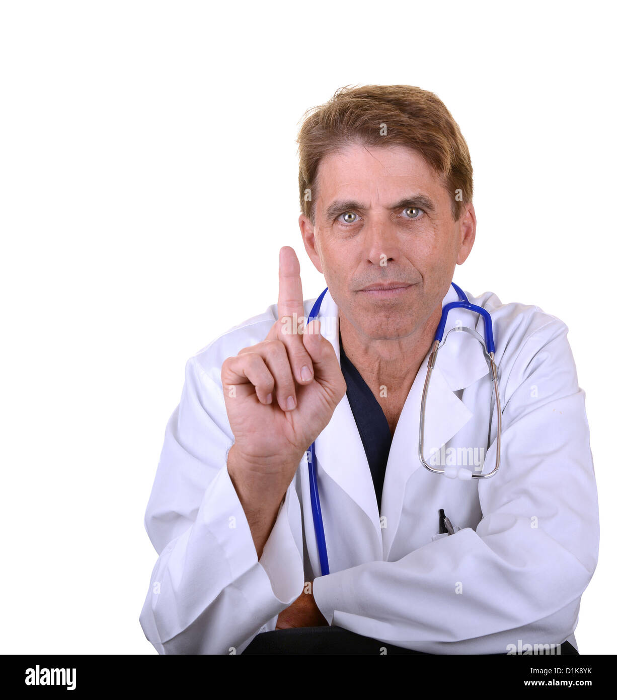 handsome doctor sitting on chair holding up one finger isolated on ...