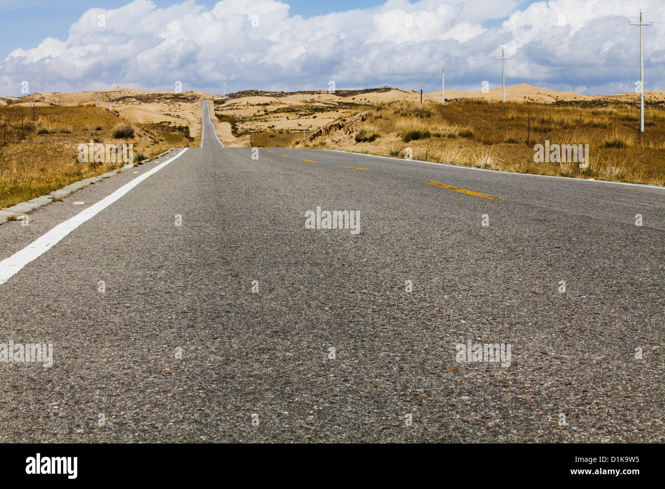 Road going through field in Qinghai province, China Stock Photo - Alamy