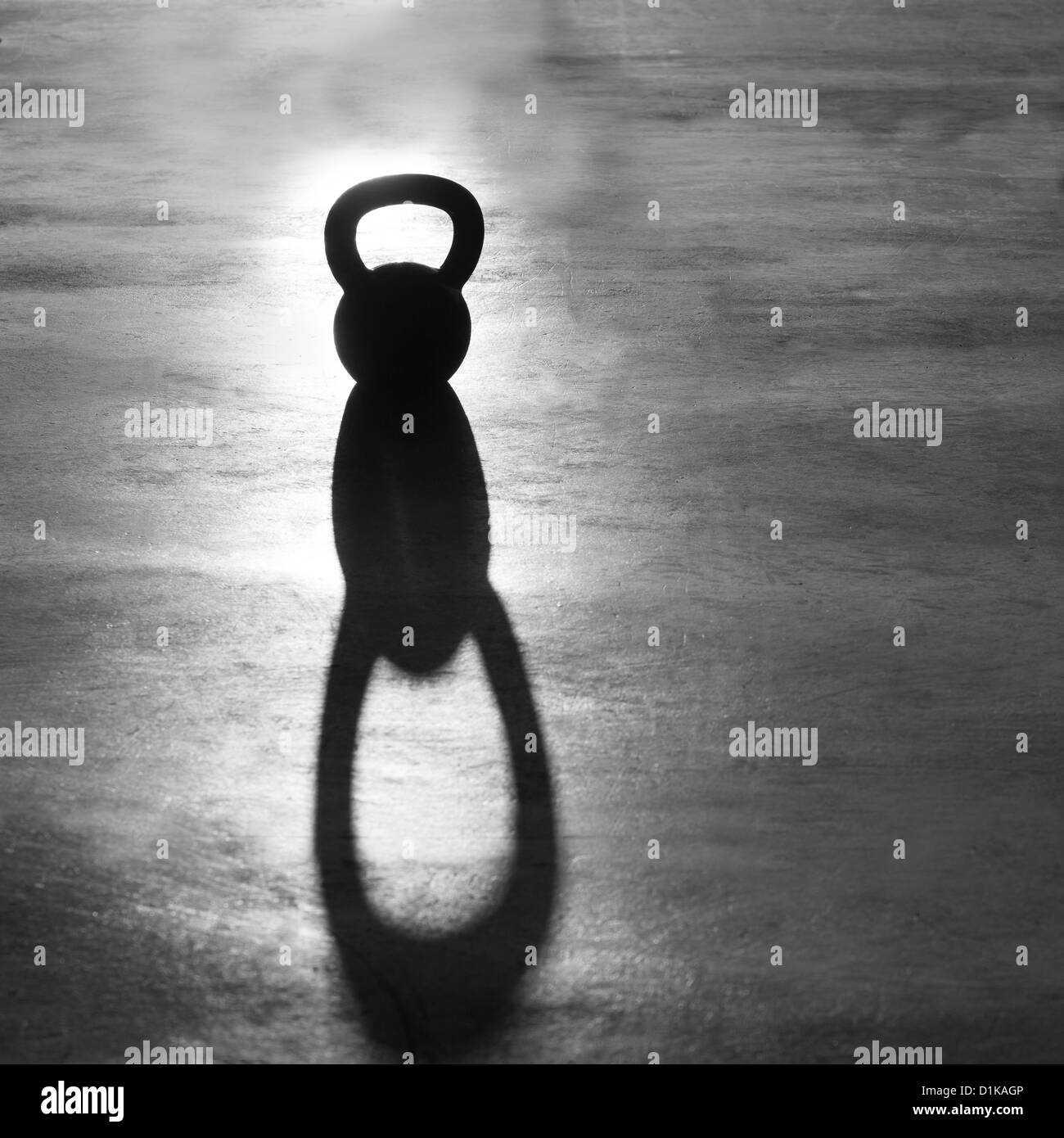 Crossfit Kettlebell weight backlight and shadow on the gym floor Stock ...