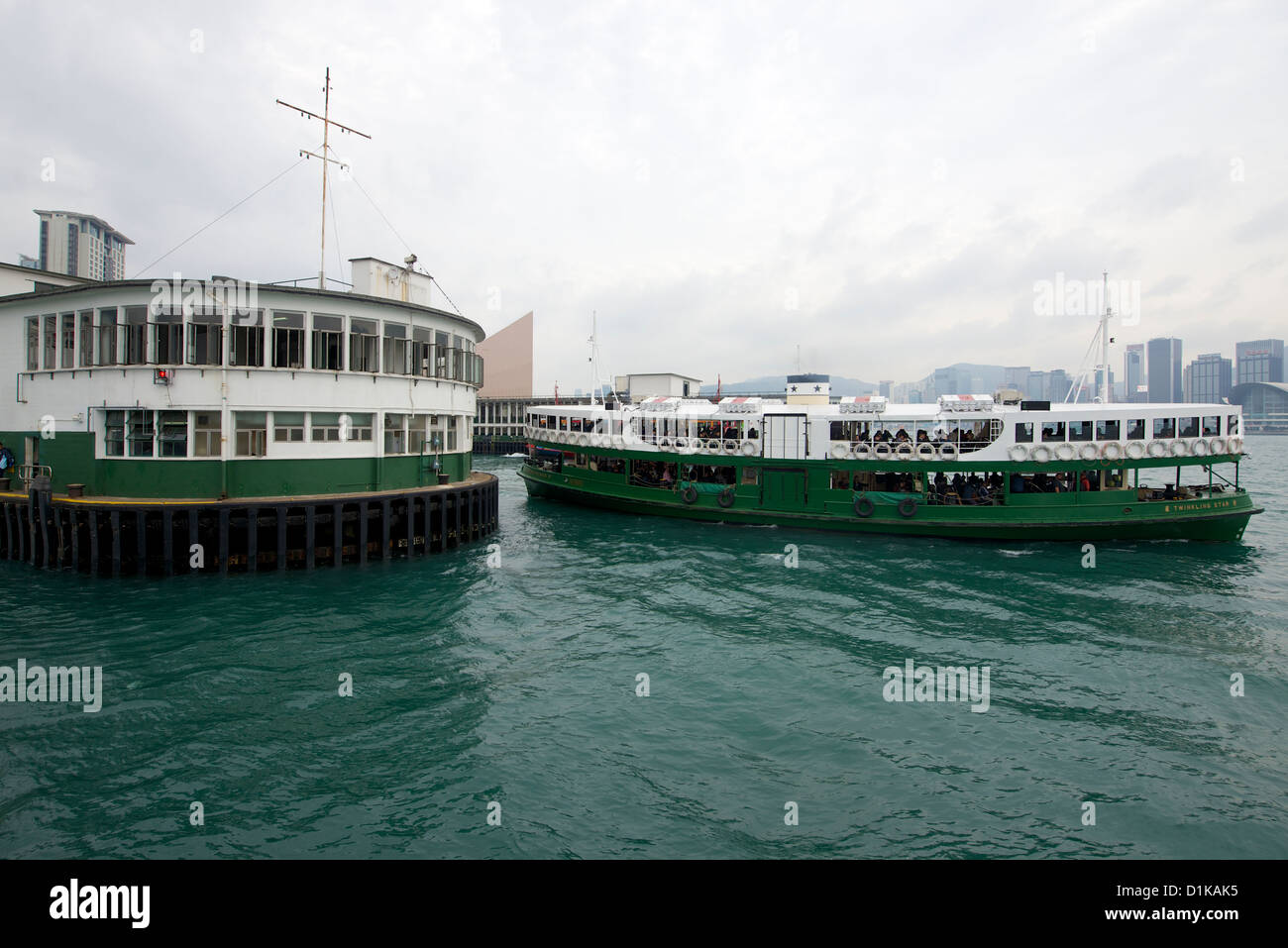 Star Ferry approaching TST harbour front Stock Photo - Alamy