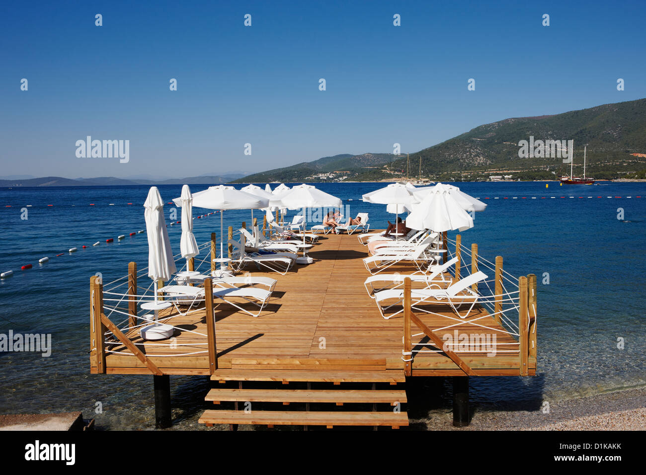 Overwater beach platform for sunbathing and swimming. Torba village ...