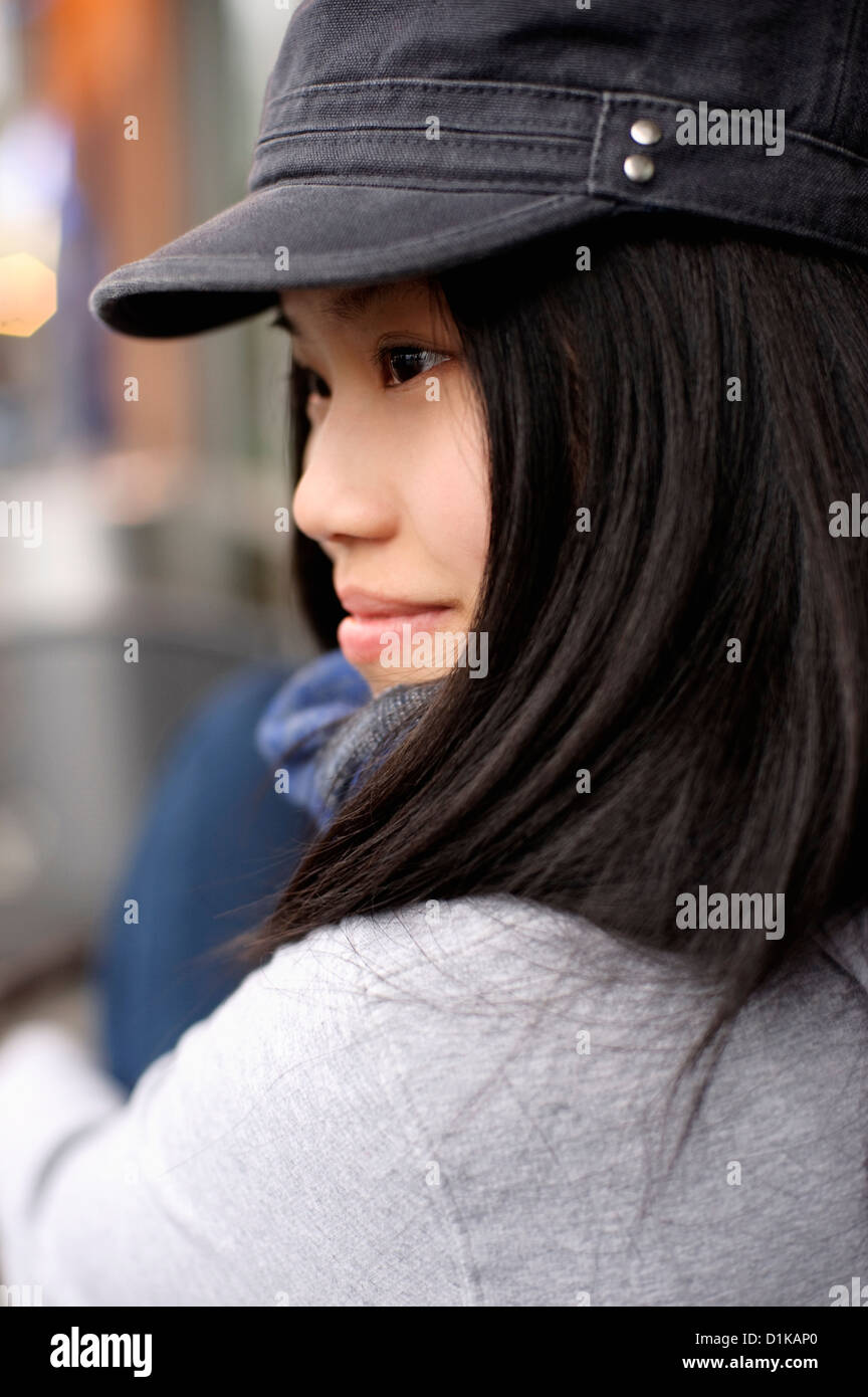 Head shot of young woman wearing a cap Stock Photo - Alamy