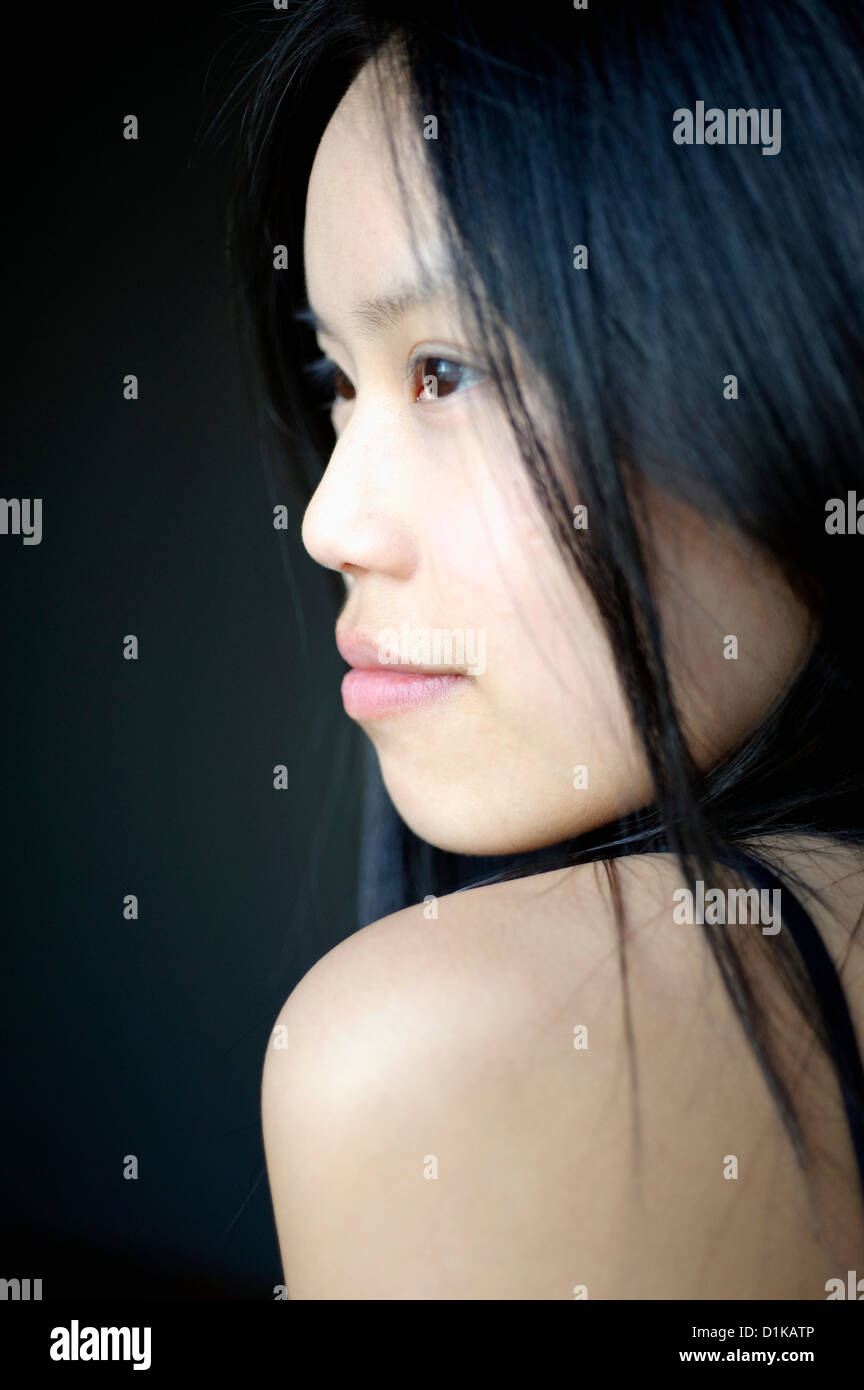 Head shot of young woman's profile Stock Photo - Alamy