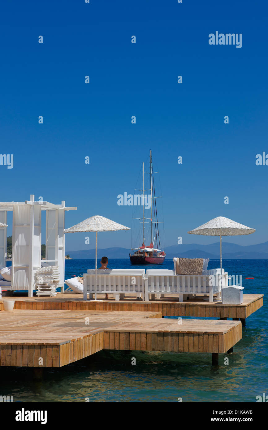 Overwater beach platform for sunbathing and swimming. Torba village ...