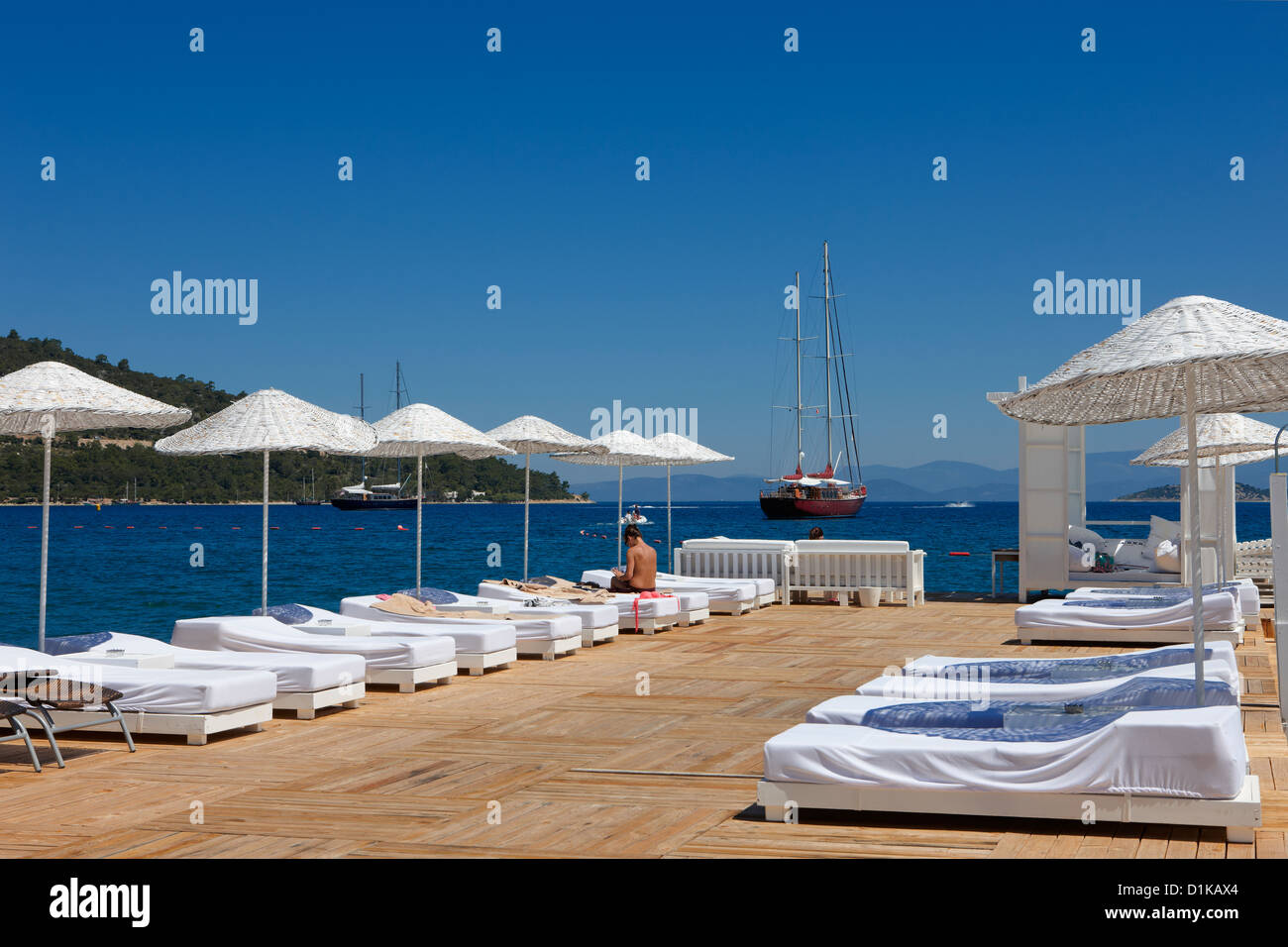 Overwater beach platform for sunbathing and swimming. Torba village ...