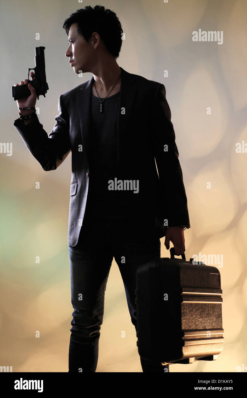 Chinese man with a gun hi-res stock photography and images - Alamy