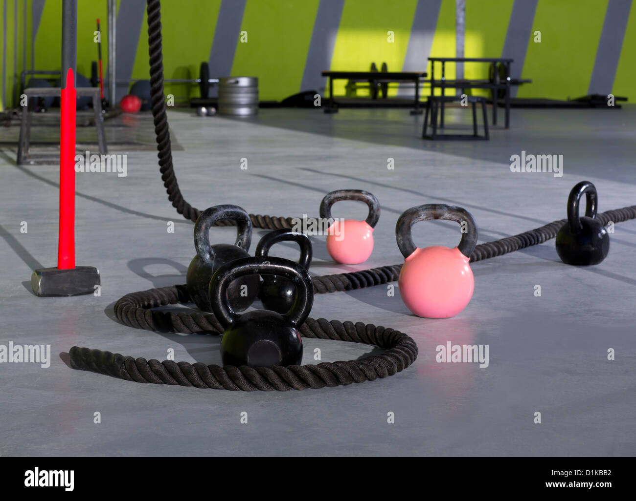 Crossfit Kettlebells ropes and hammer gym with lifting bars and wall ...