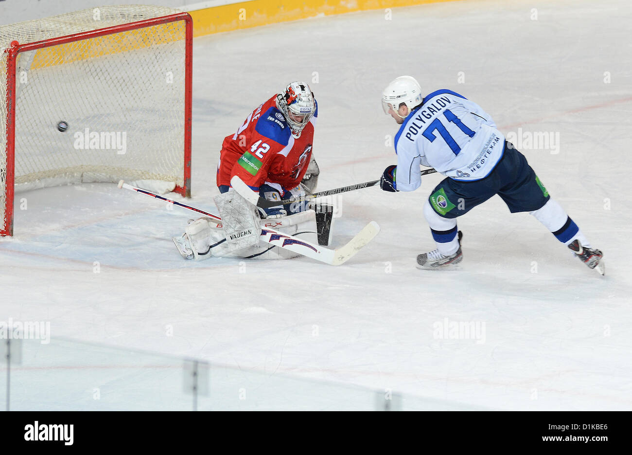 Igor Polygalov(right) of Neftekhimik shoots goal to Tomas Popperle of ...